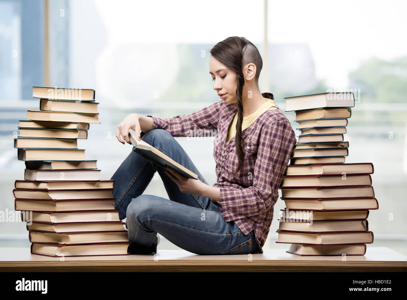The young student with stack of books Stock Photo - Alamy