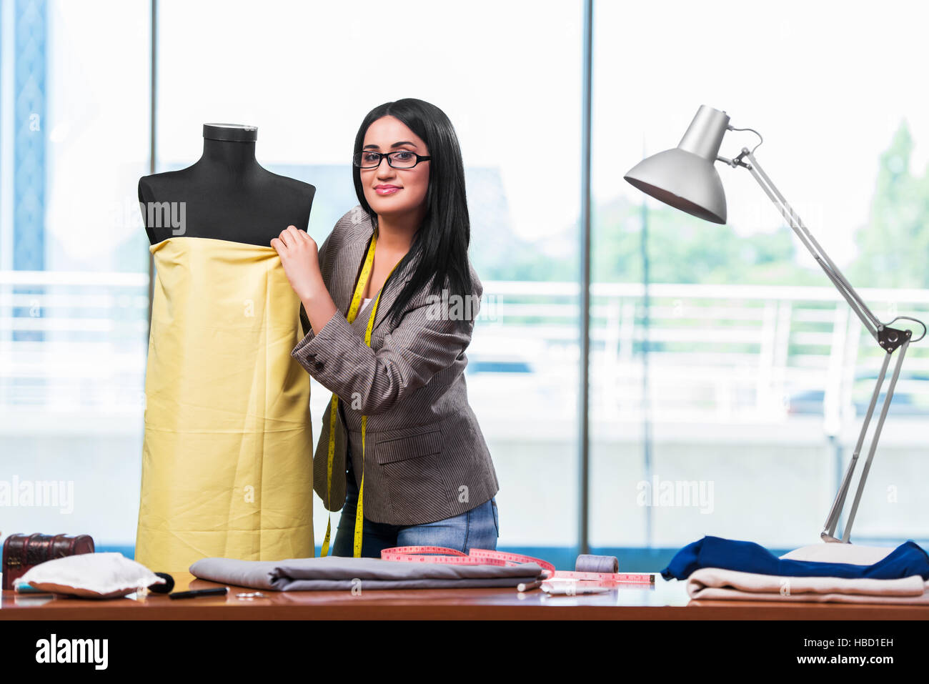 The woman tailor working on new clothing Stock Photo - Alamy