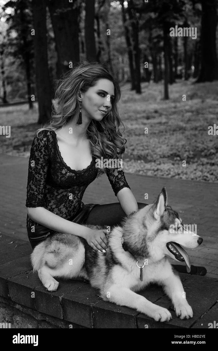 Girl in the park with a dog Husky. The girl with the siberian husky ...