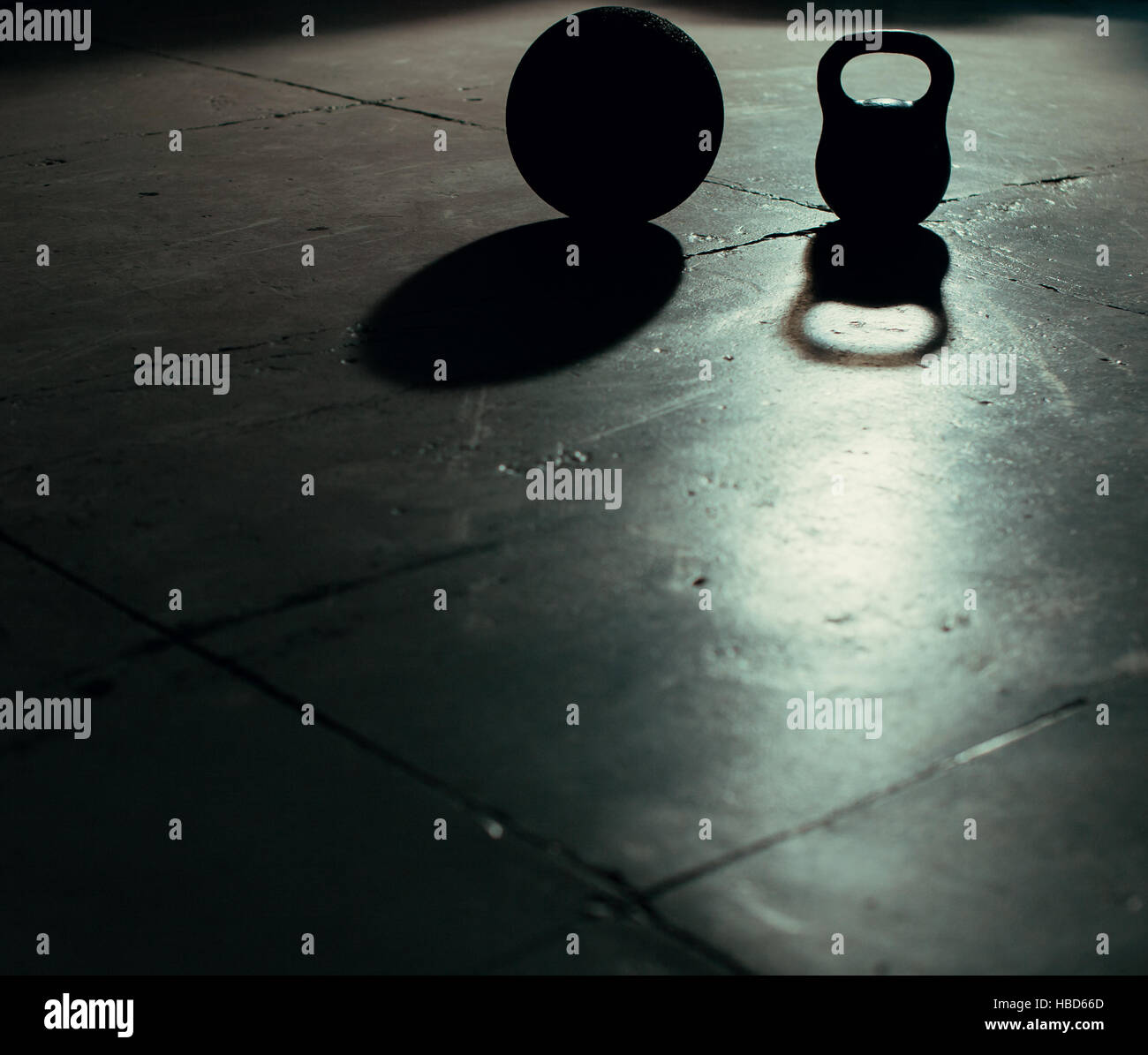 Crossfit Kettlebell weight and ball backlight and shadow Stock Photo ...