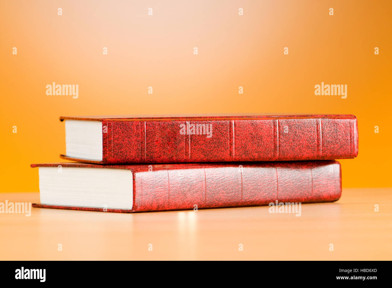 Education concept with red cover books Stock Photo - Alamy