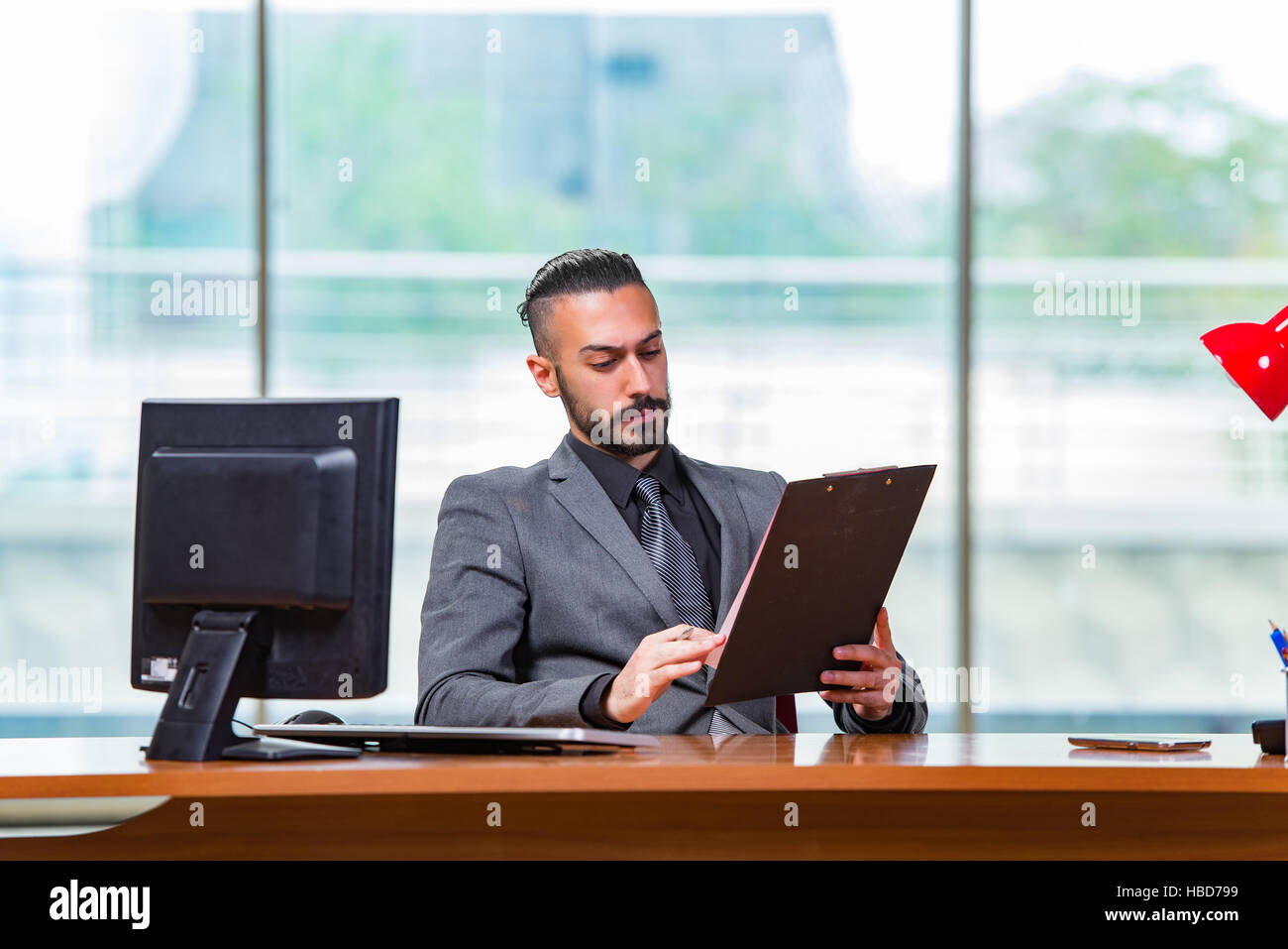 Sad businessman sitting in the office Stock Photo - Alamy