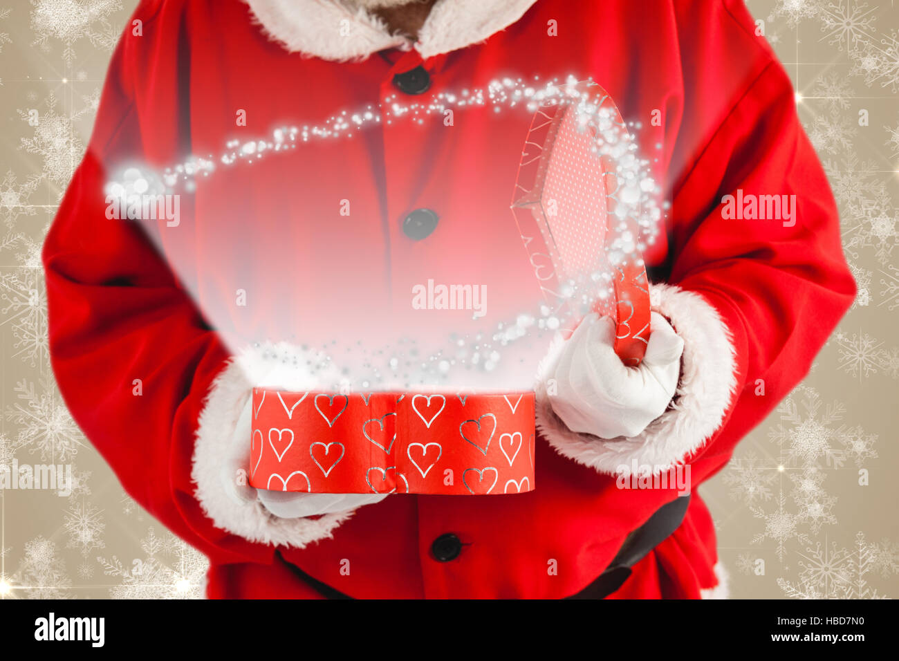 Composite image of santa claus opening a gift box Stock Photo - Alamy