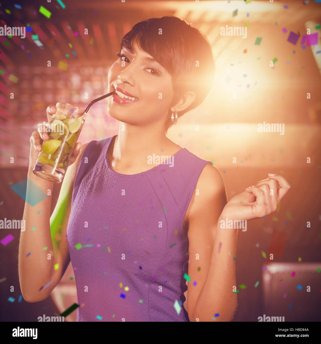 Young woman drinking cocktail dancing hi-res stock photography and ...