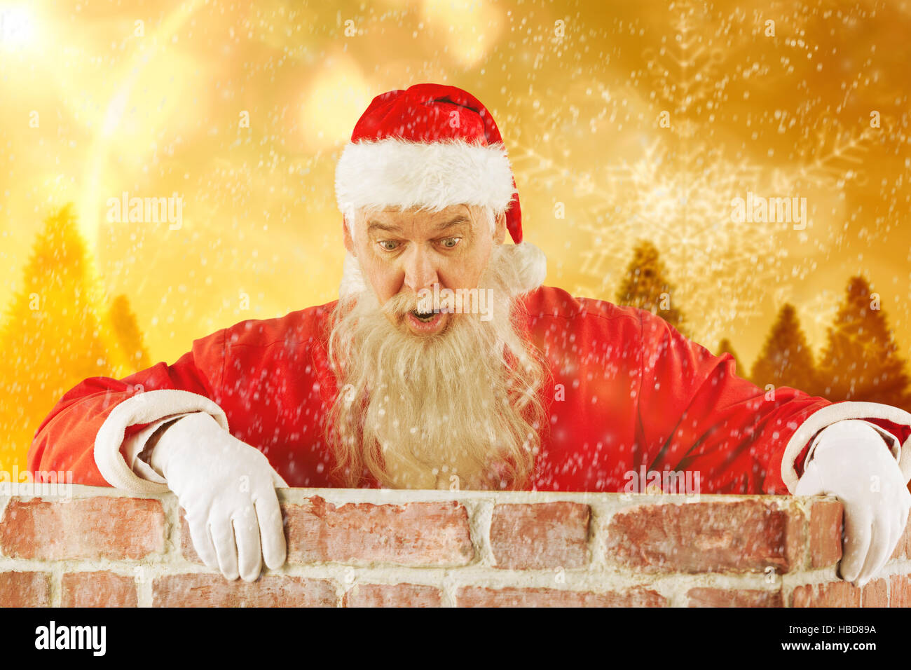 Composite image of santa claus peeking over wall Stock Photo - Alamy