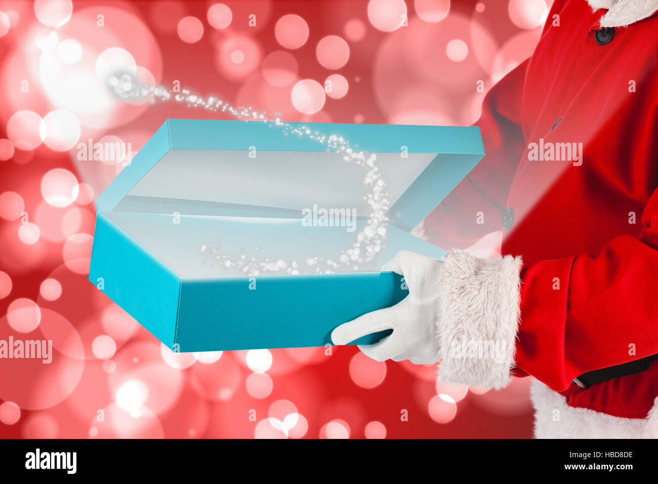 Composite image of santa claus opening gift box Stock Photo - Alamy