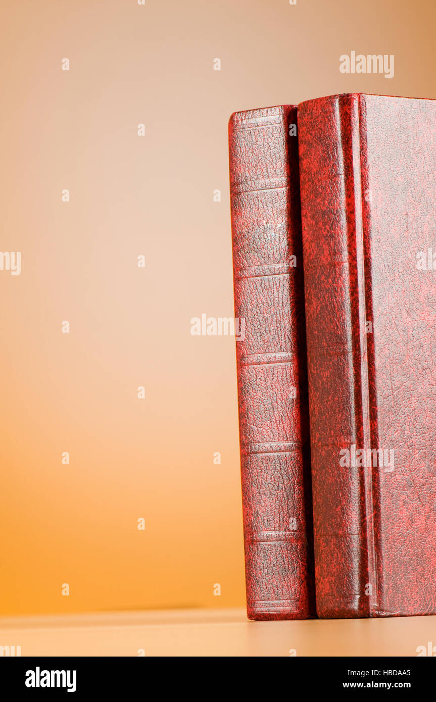 The education concept with red cover books Stock Photo - Alamy