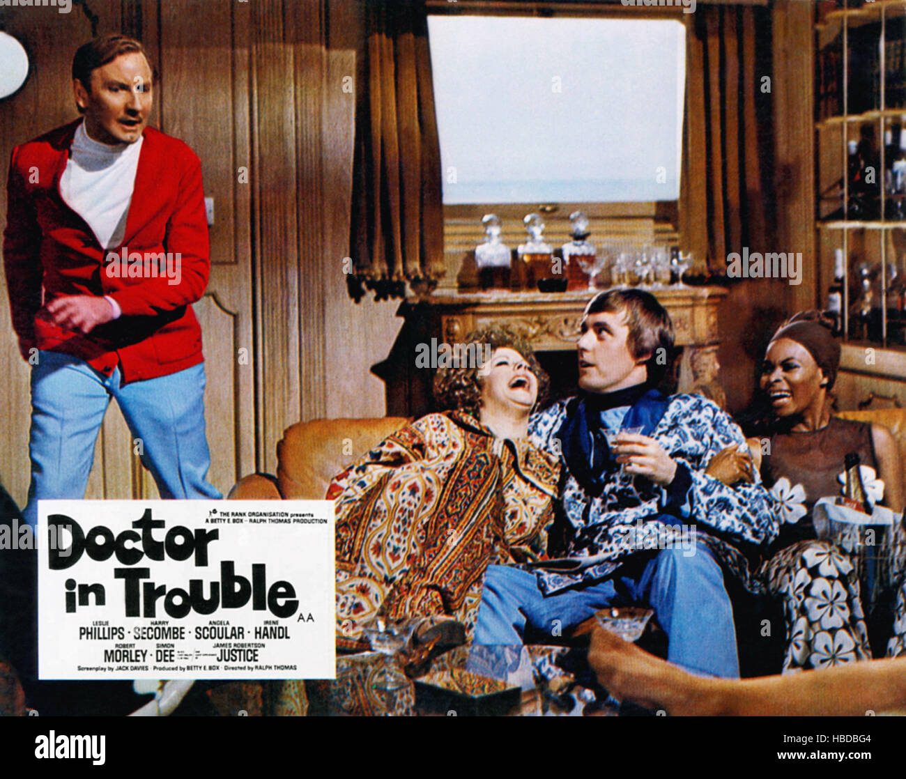 DOCTOR IN TROUBLE, Leslie Phillips (left), Angela Scoular (2nd from ...