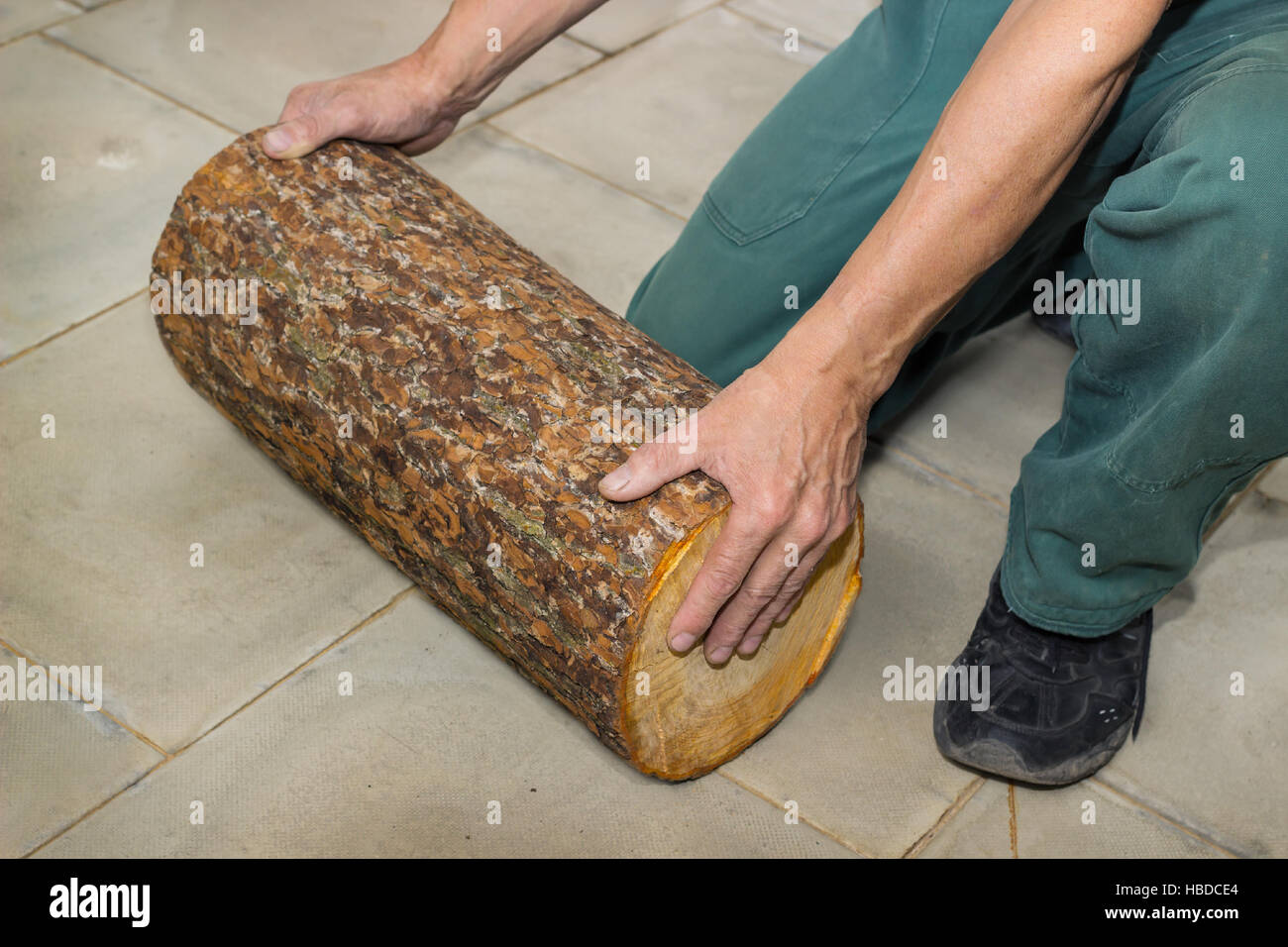Billet of logs in the hands of a carpenter Stock Photo - Alamy