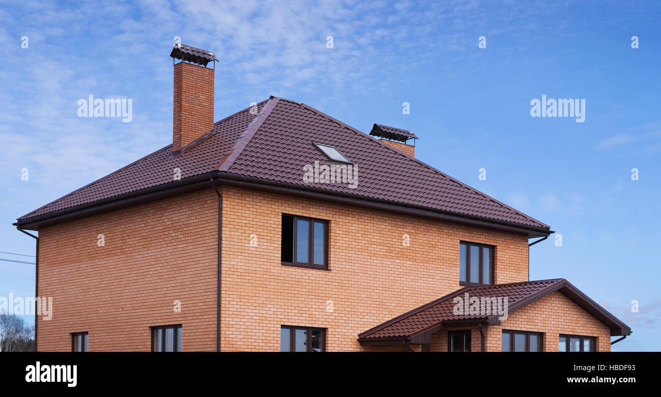 Roof tiles in a brick house Stock Photo - Alamy