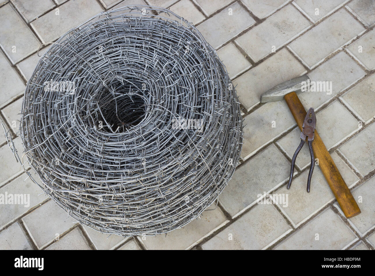 Barbed wire coil hi-res stock photography and images - Alamy
