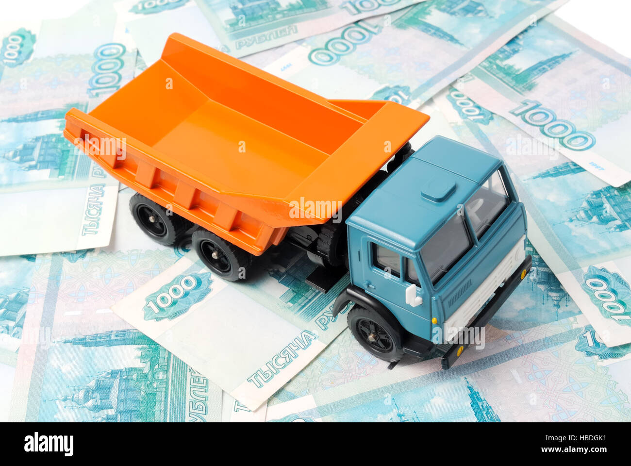 Toy car on the background of banknotes Stock Photo - Alamy