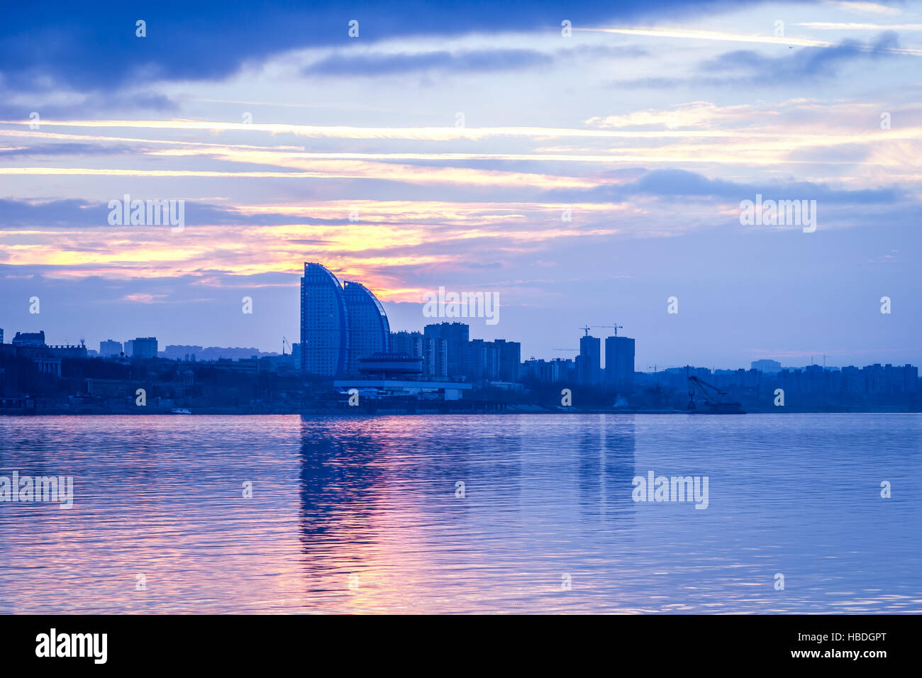 Reflection of urban architecture in the river at sunset Stock Photo - Alamy