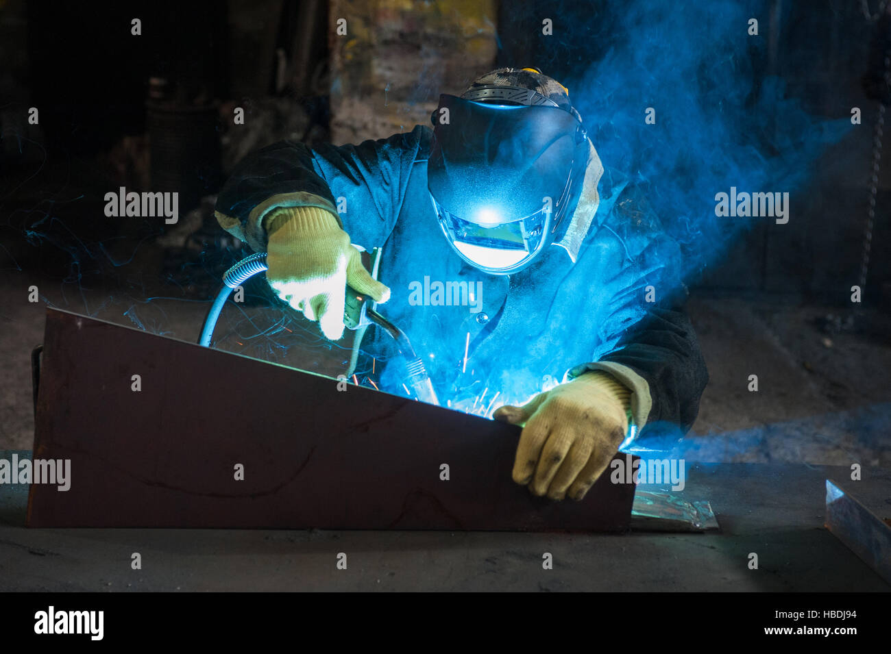 worker welding metal Stock Photo - Alamy