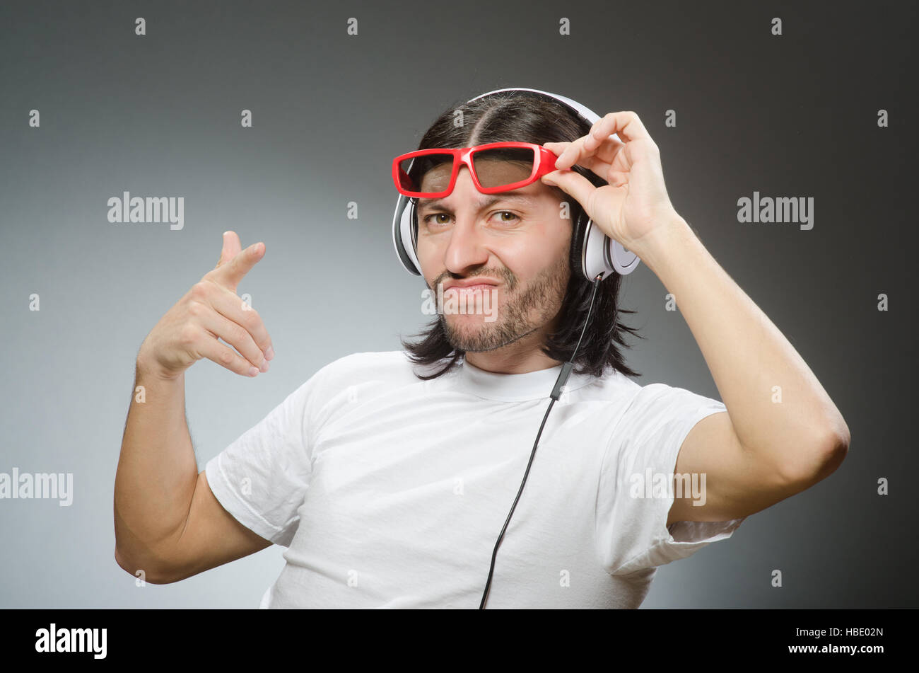 Young man with headphones in DJ concept Stock Photo - Alamy