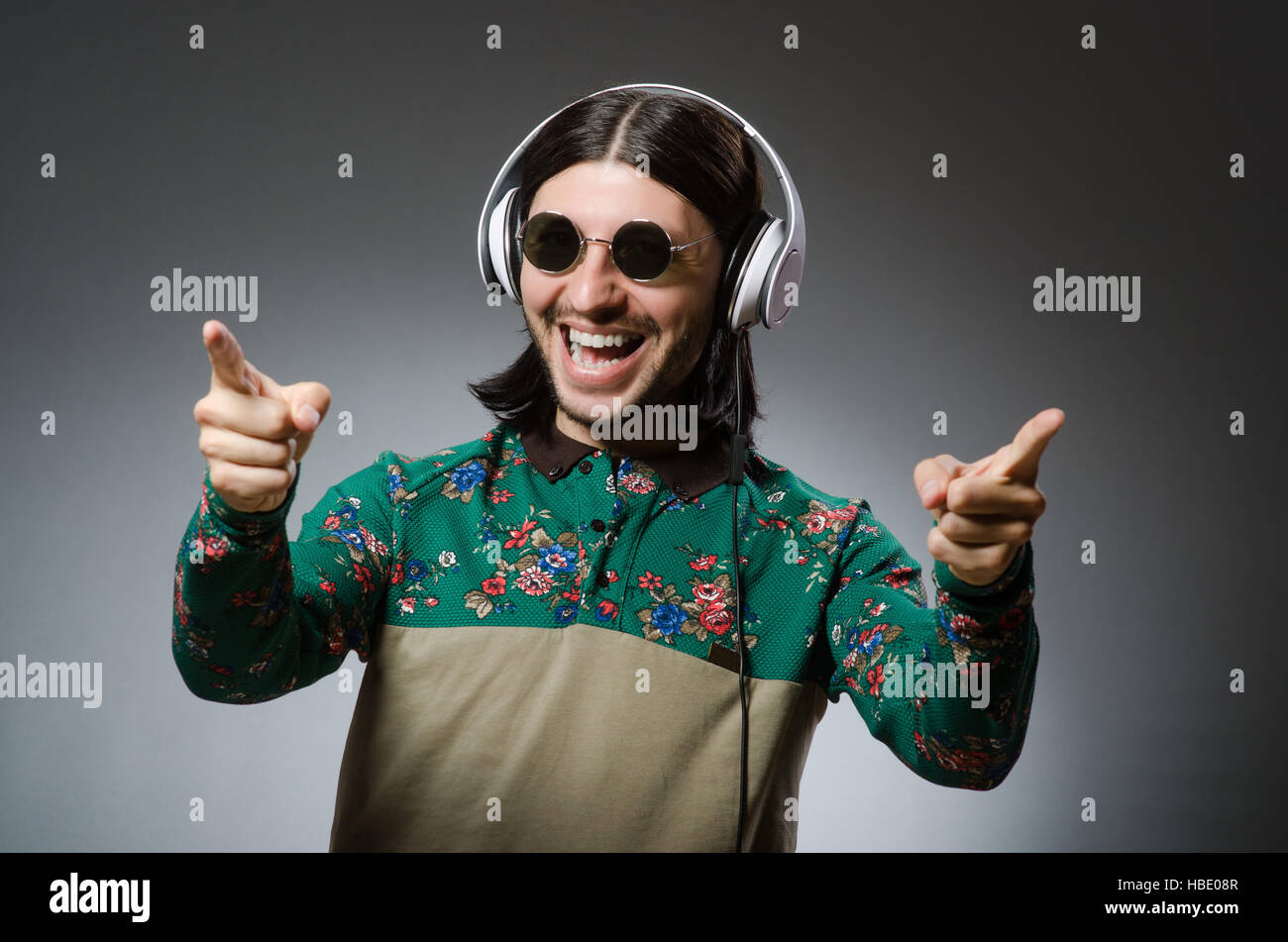 Young man with headphones in DJ concept Stock Photo - Alamy