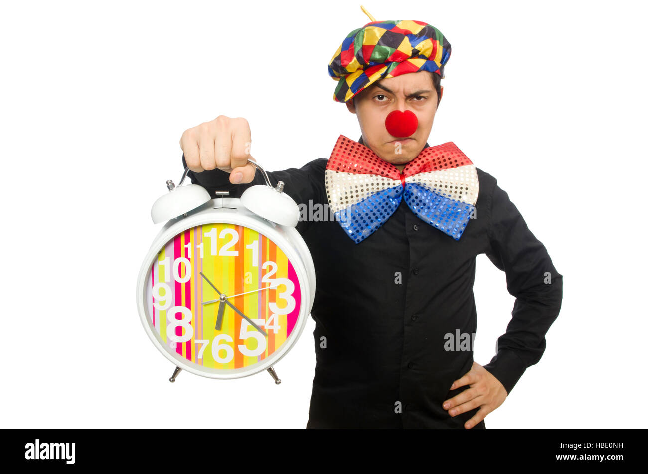Funny clown with clock isolated on white Stock Photo - Alamy
