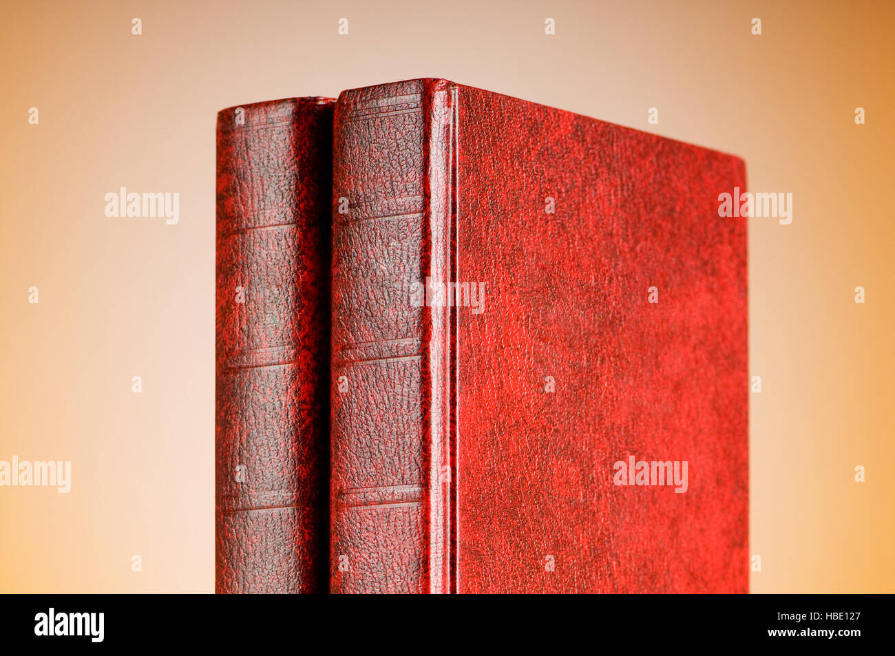 Education concept with red cover books Stock Photo - Alamy
