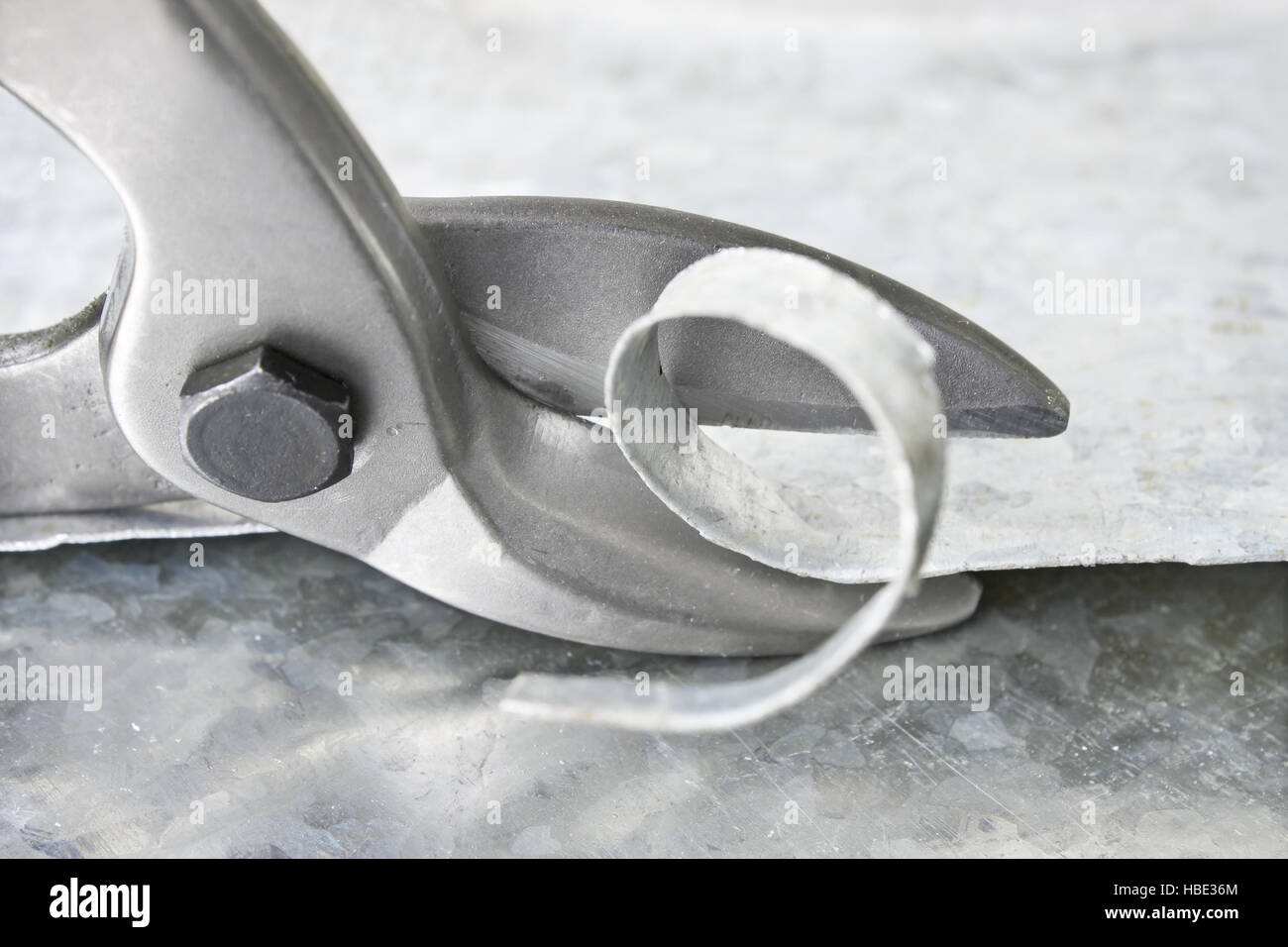 Scissors cut metal into strips Stock Photo - Alamy