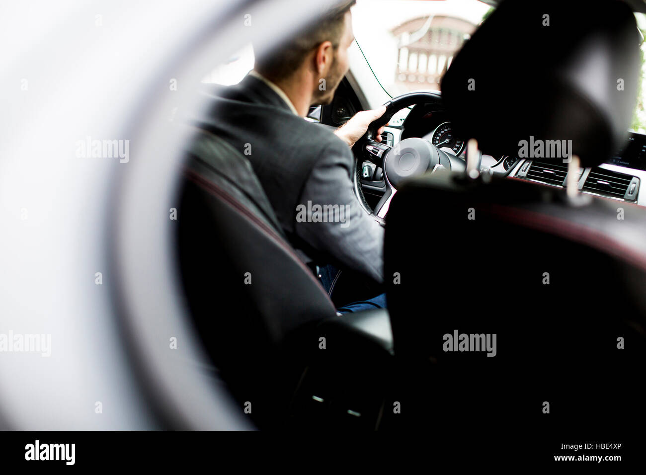 Young man driving in the modern car Stock Photo - Alamy