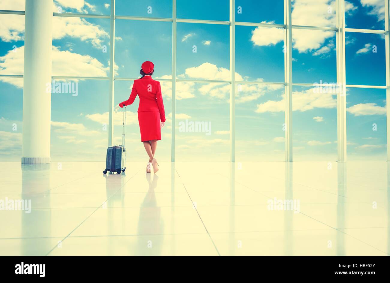 Stewardess in airport Stock Photo - Alamy