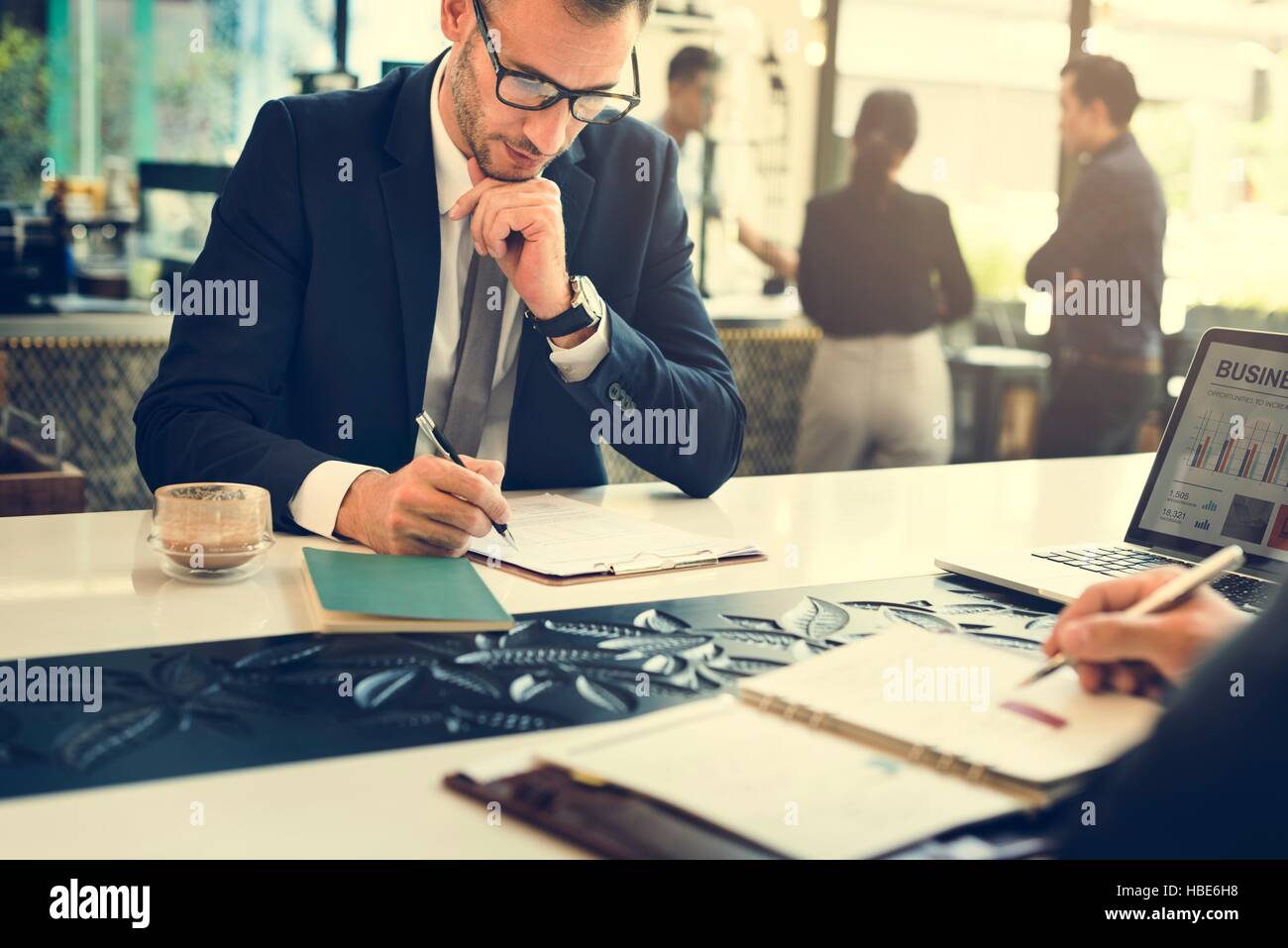 Serious Business Man Filling Out Form Concept Stock Photo - Alamy