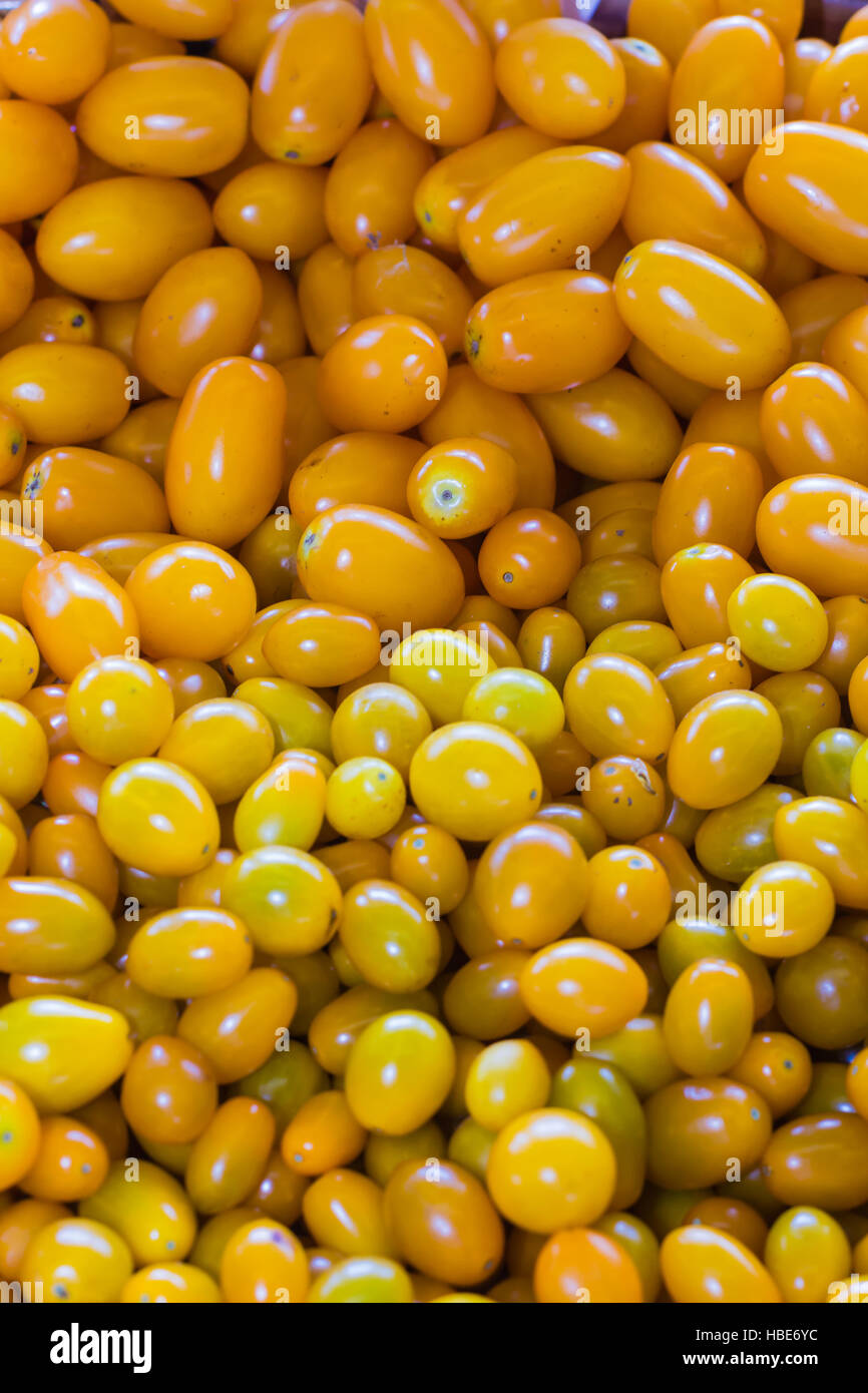 Yellow Cherry Tomatoes at a produce stand Stock Photo - Alamy