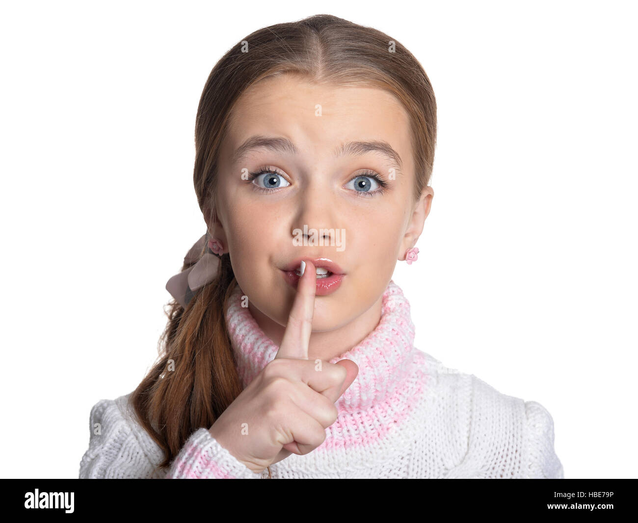 Little girl showing hush sign Stock Photo - Alamy