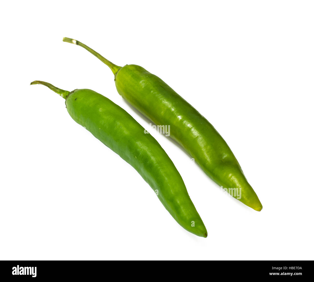 Colorful chili peppers on a white background Stock Photo - Alamy