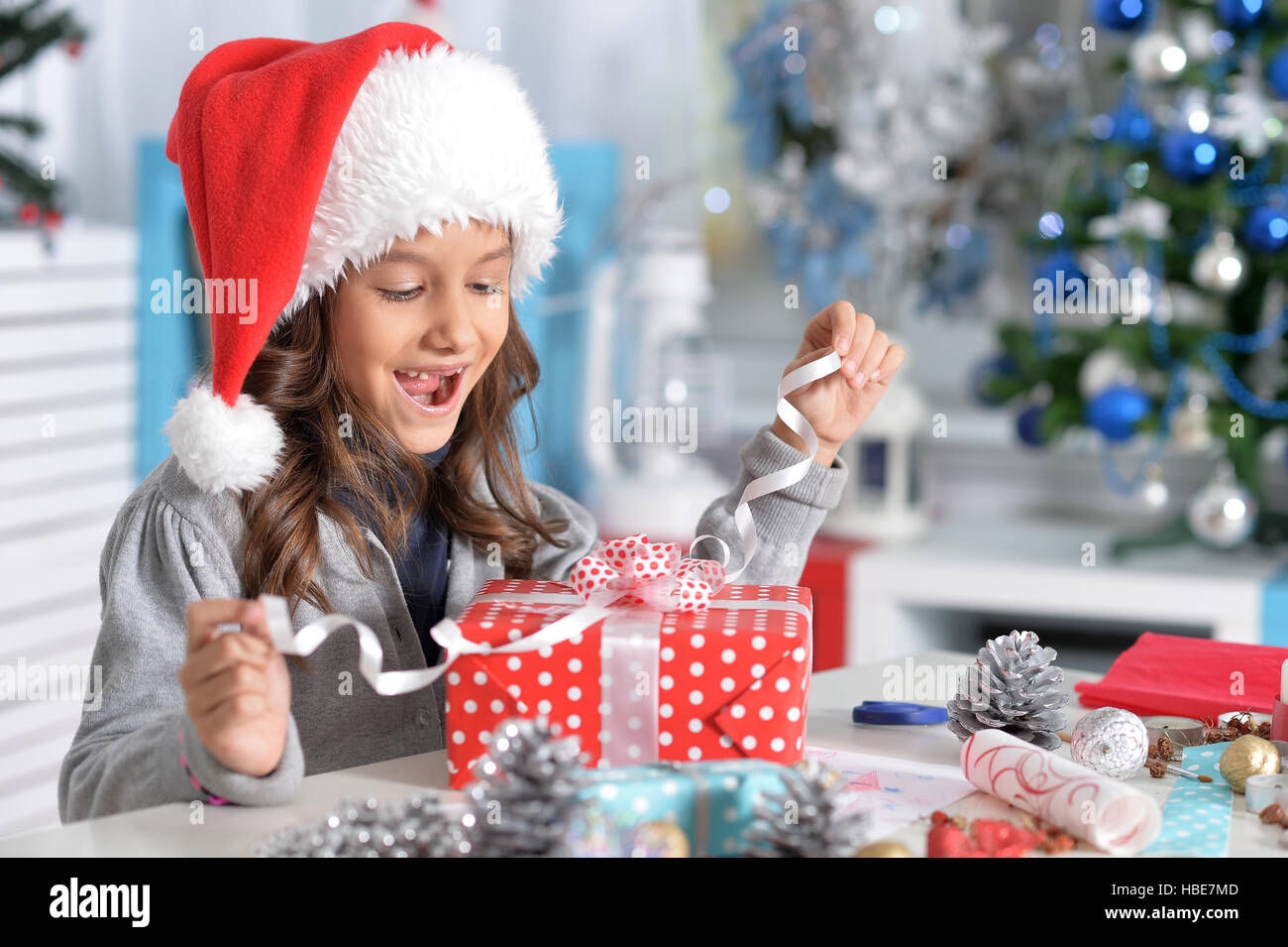 Child with Christmas present Stock Photo - Alamy