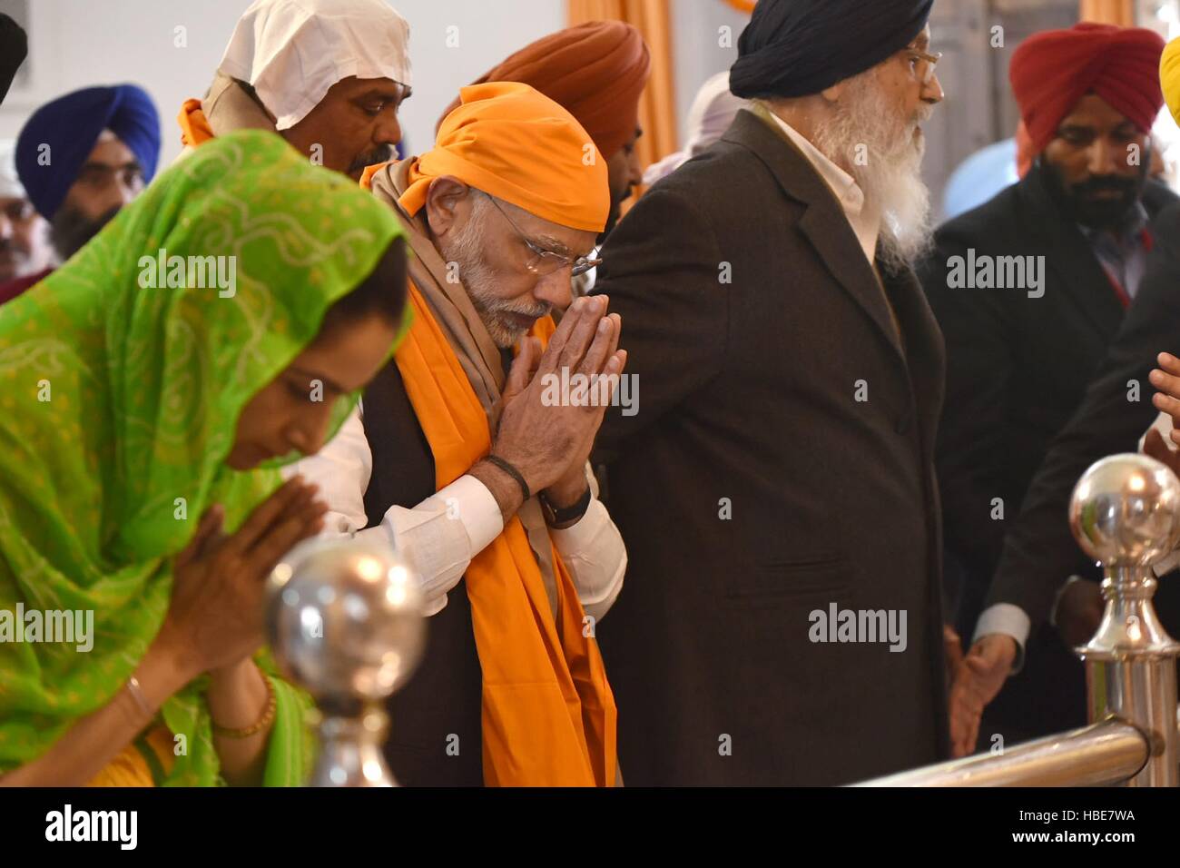Indian Prime Minister Narendra Modi prays during a visit to Anandpur ...