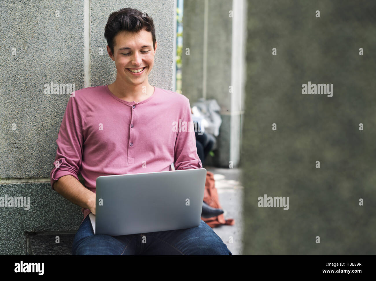 Young Guy Browsing Laptop Campus Concept Stock Photo - Alamy