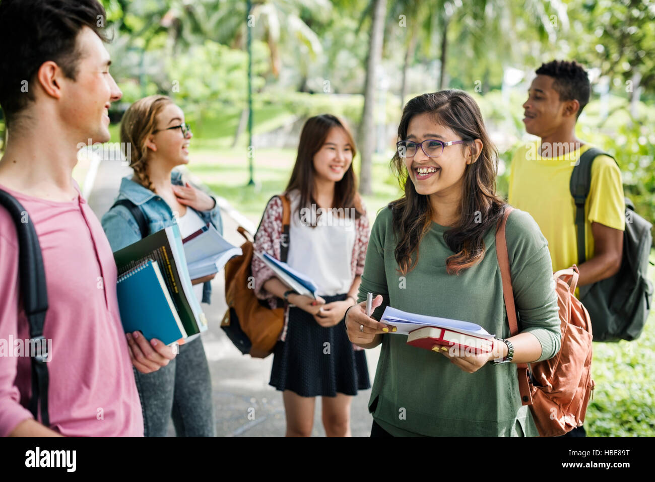 Diverse Young Students Book Outdoors Concept Stock Photo - Alamy