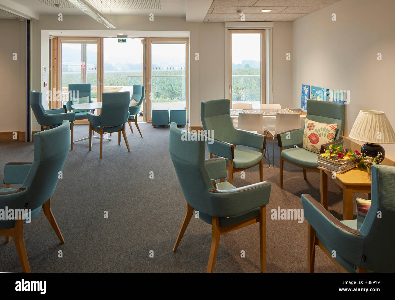 Communal sitting room with garden view. St Michael's Hospice, Hereford ...