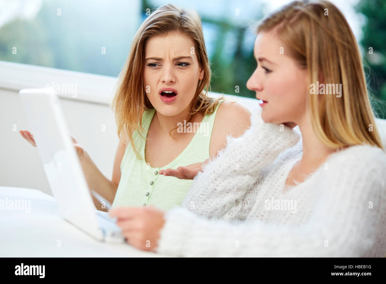 Two girls overspent on accounts Stock Photo - Alamy