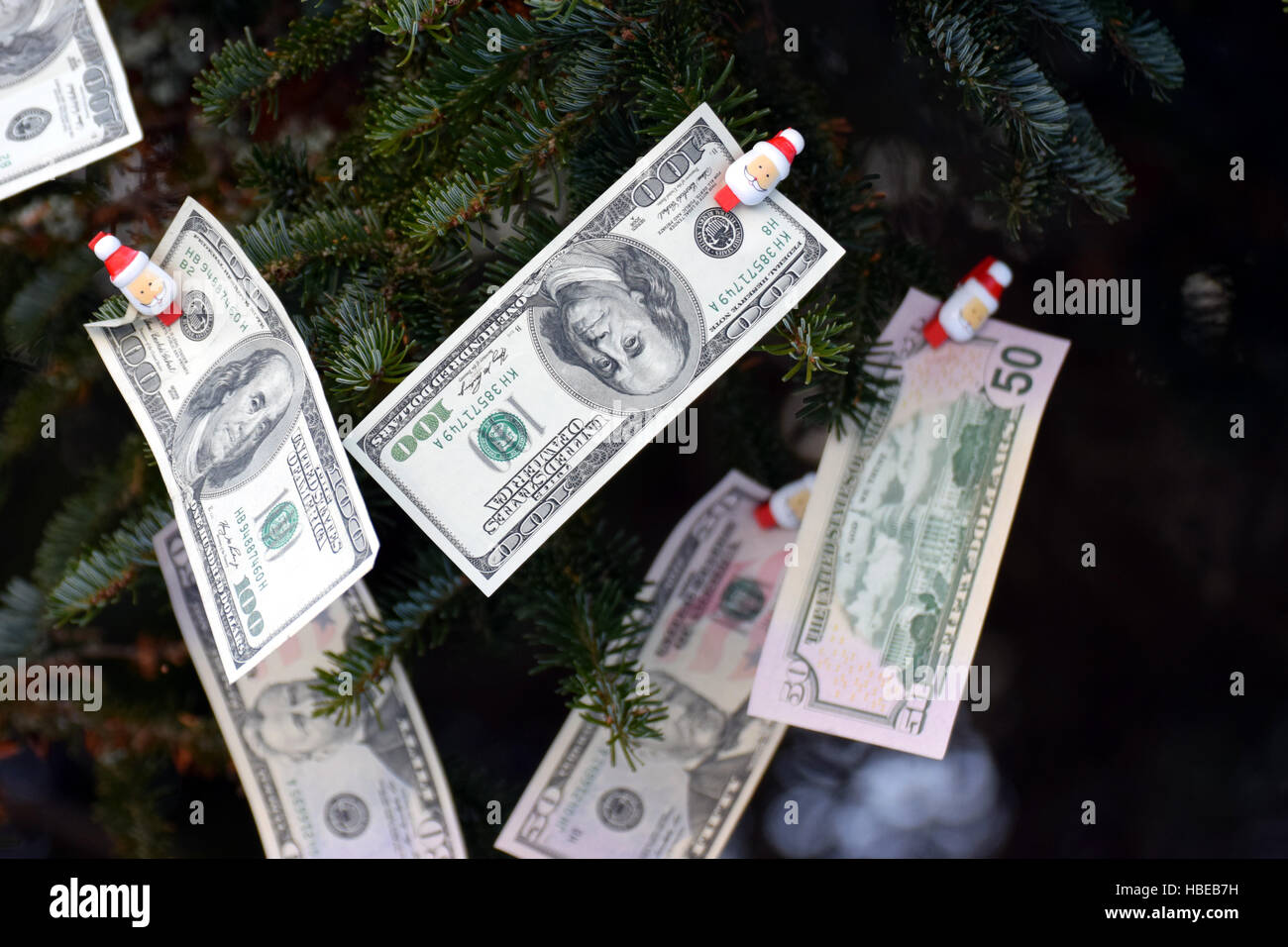 Money in Christmas tree Stock Photo - Alamy