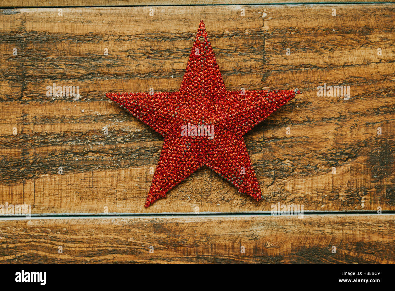 Bright red star for decoration on a rustic wooden background Stock ...