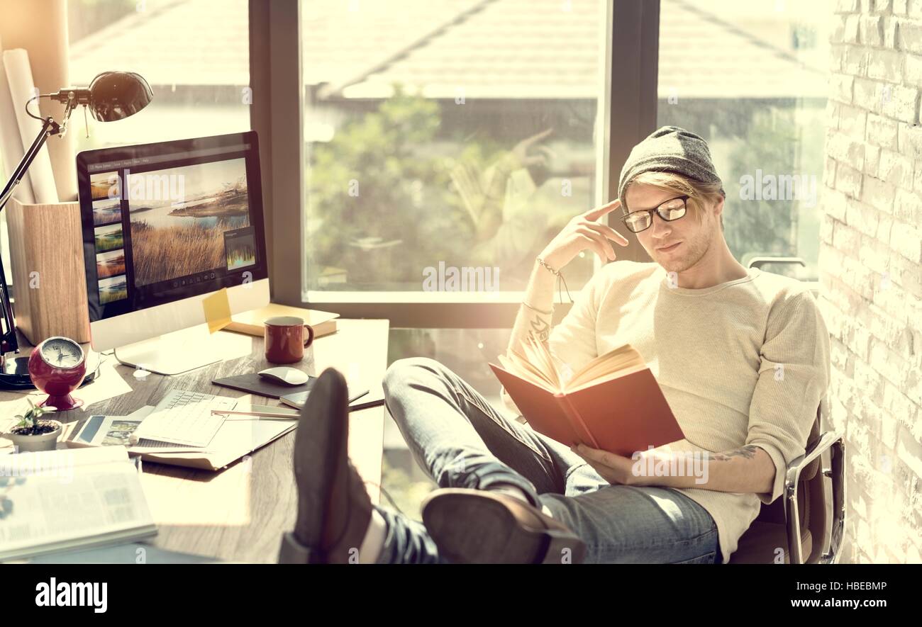 Man Reading Book Knowledge Relax Concept Stock Photo - Alamy