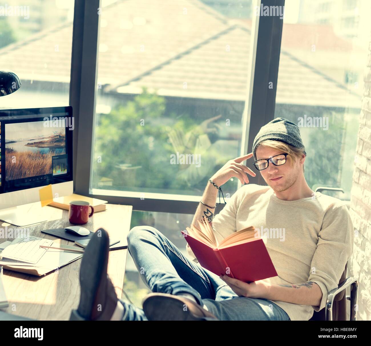Man Reading Book Knowledge Relax Concept Stock Photo - Alamy