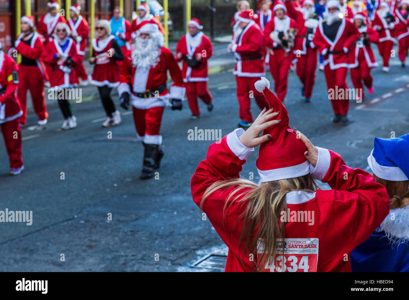 Adjusting the hat during the 2016 Santa Dash through the streets of ...