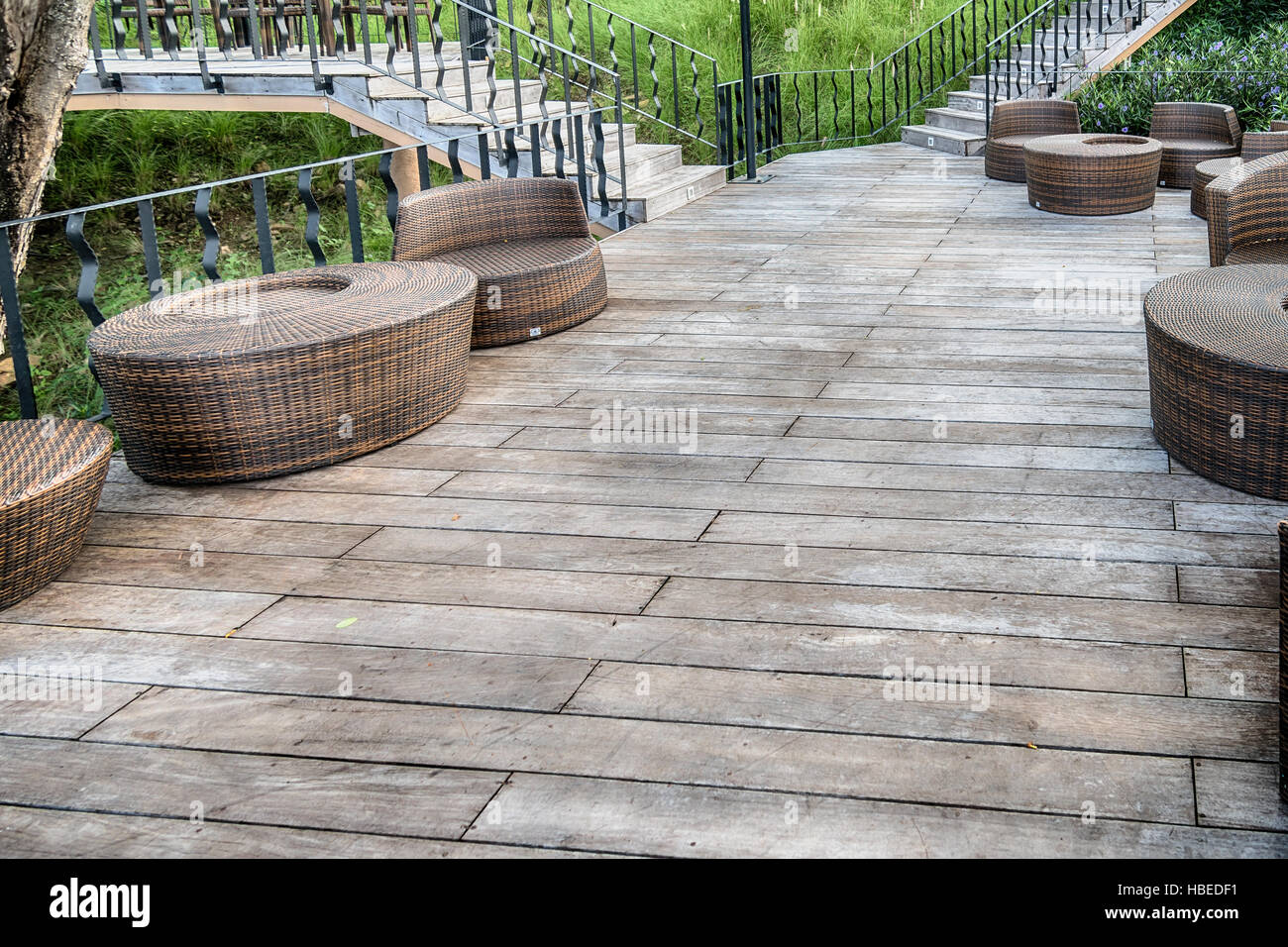 The wood table on natural outdoor of a restaurant with tree and cloudy ...