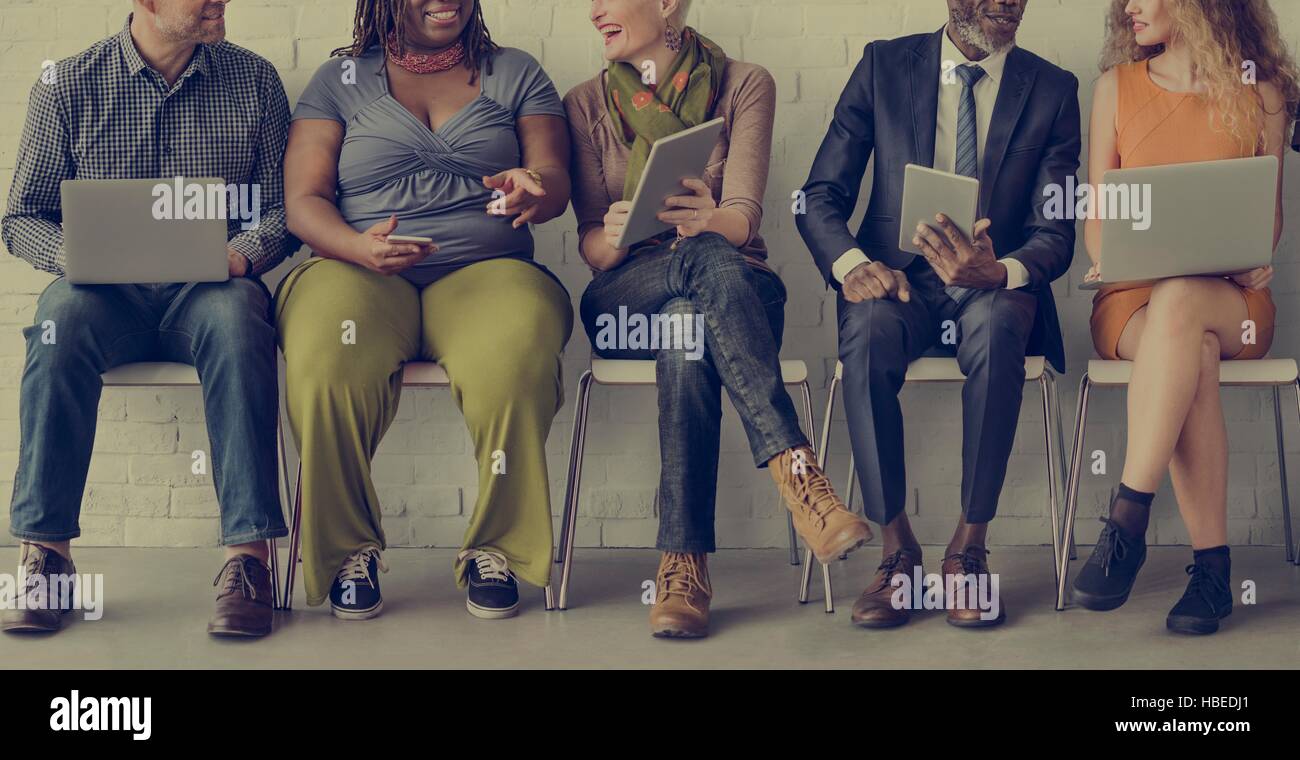 Diverse Group of People Community Togetherness Technology Sitting ...