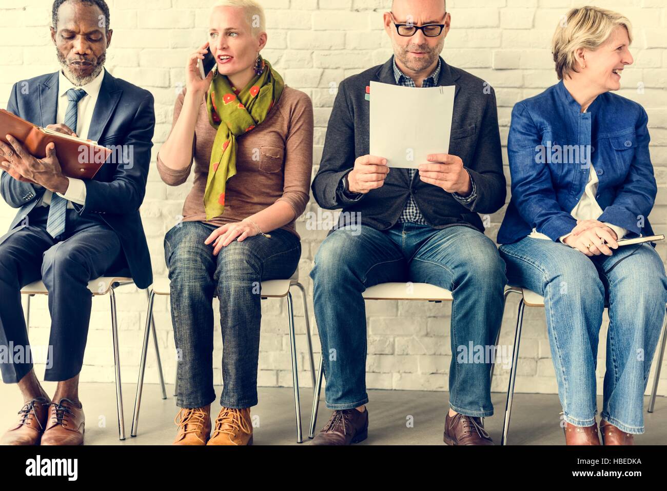 Diverse Group of People Community Sitting Waiting Concept Stock Photo ...