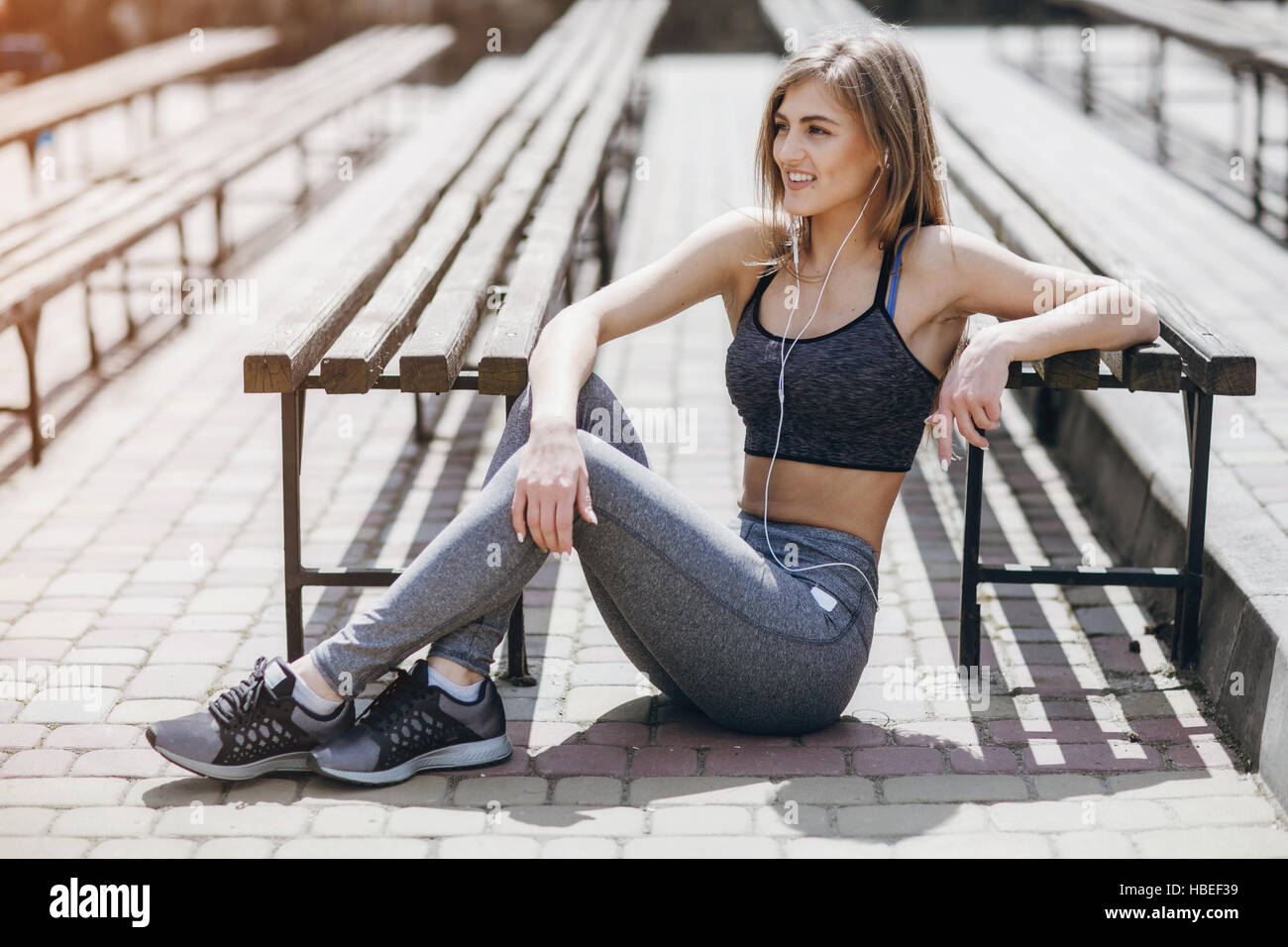 athletic girl running in the Park and doing exercises Jogging Stock ...
