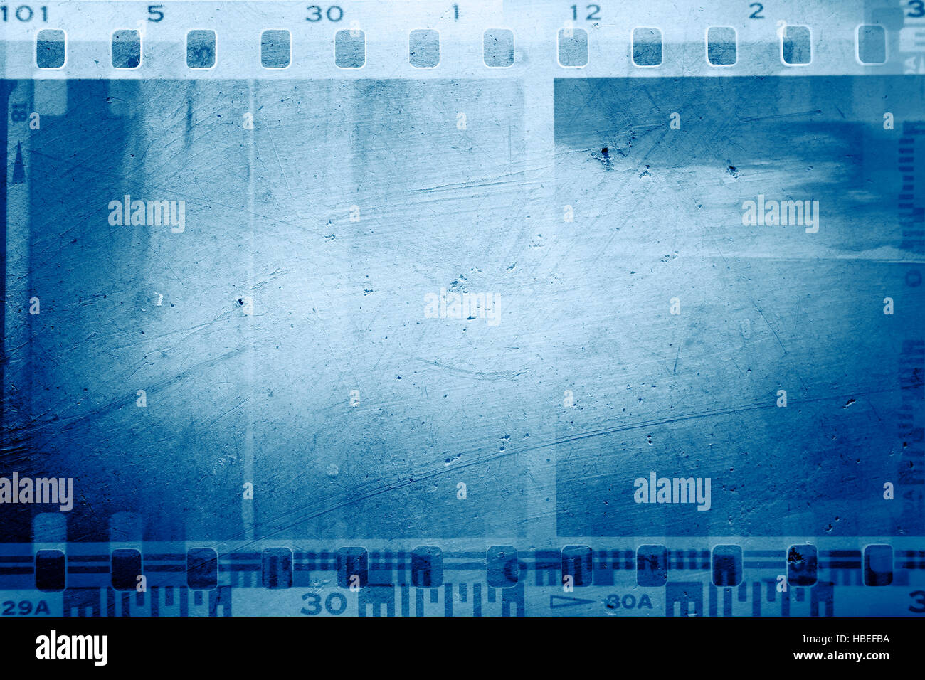 Film negative frames on blue background Stock Photo - Alamy