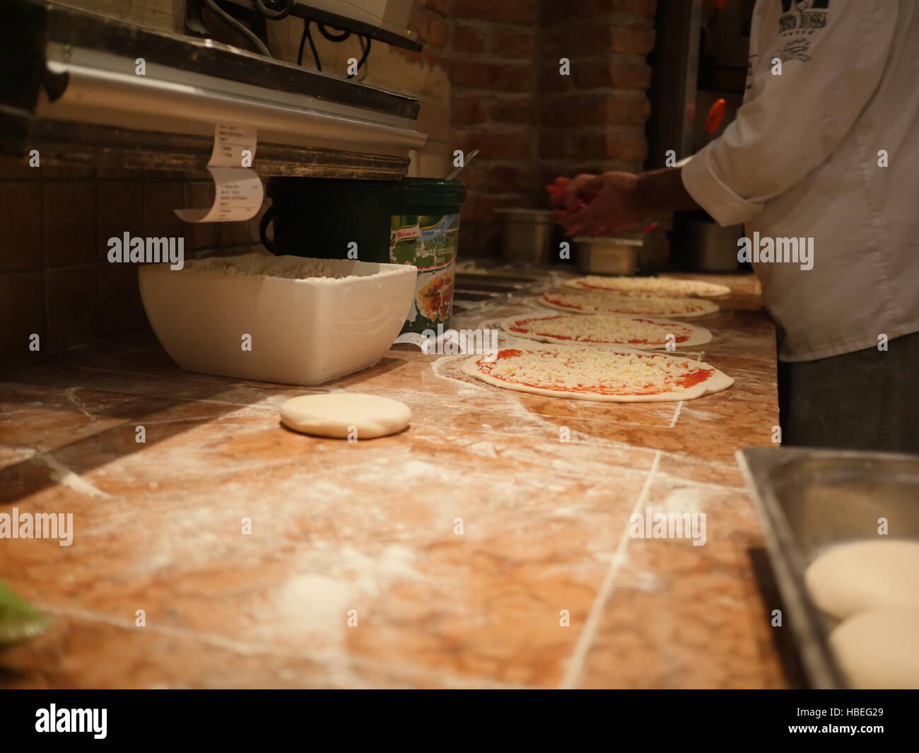 pizza preparation baking Stock Photo - Alamy