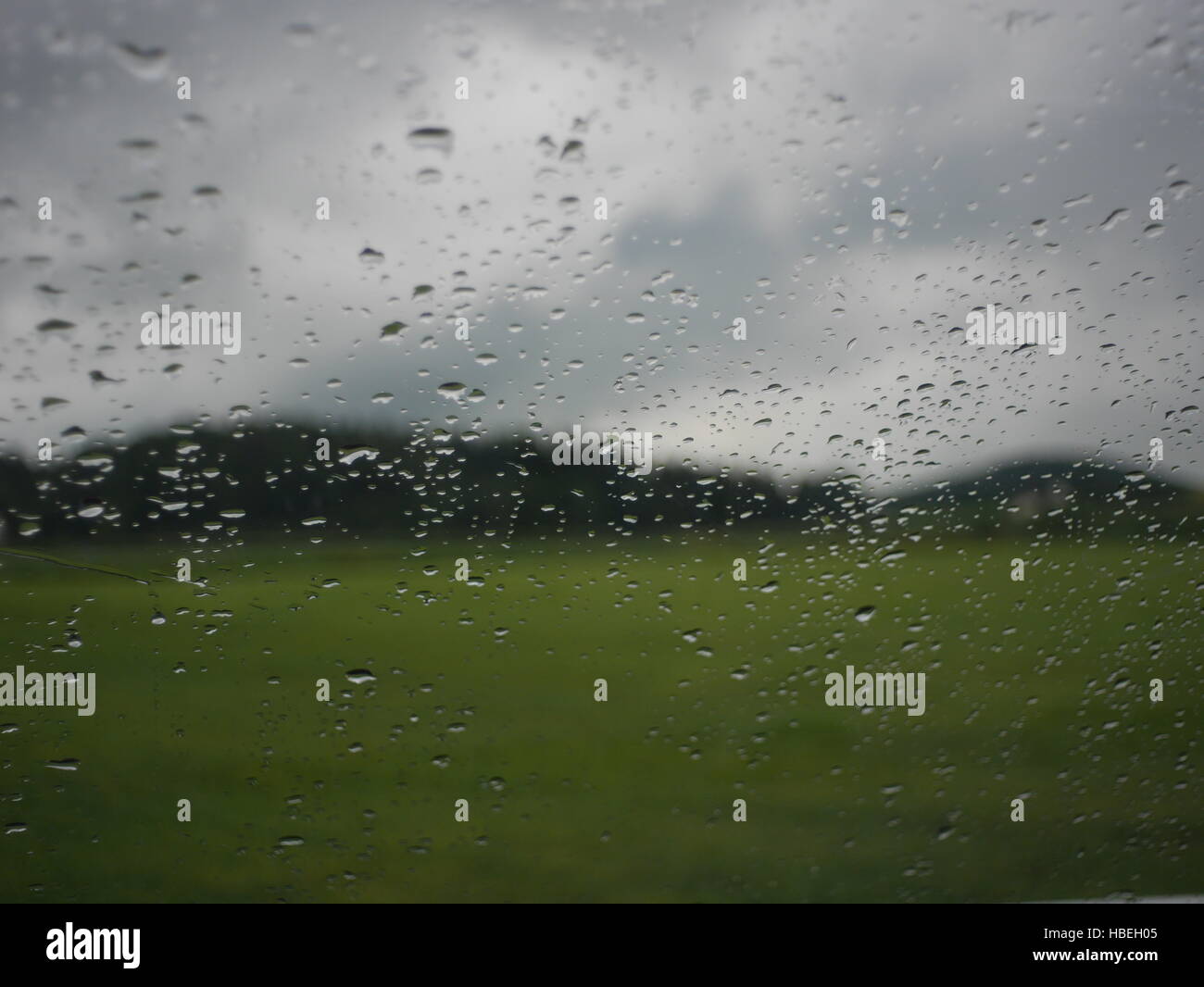 landscape through rainy window Stock Photo - Alamy