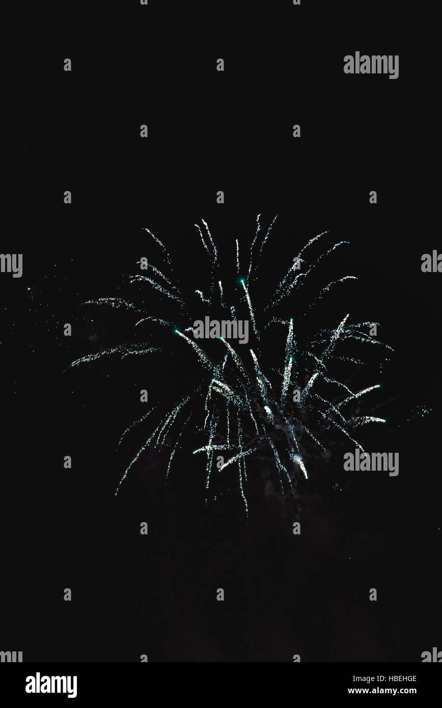 Shiny natural fireworks on dark black sky background with a little ...