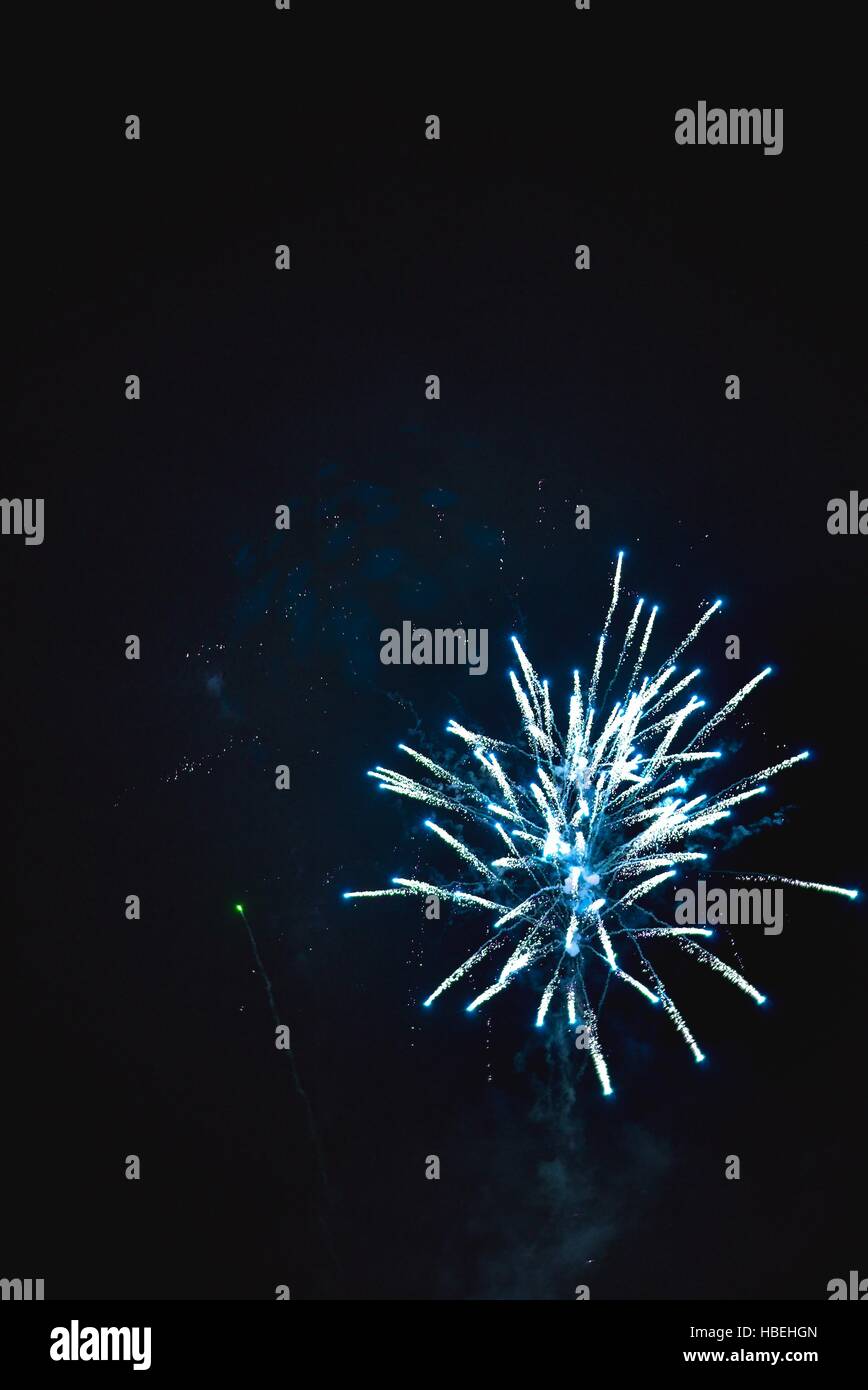 Shiny natural fireworks on dark black sky background with a little ...