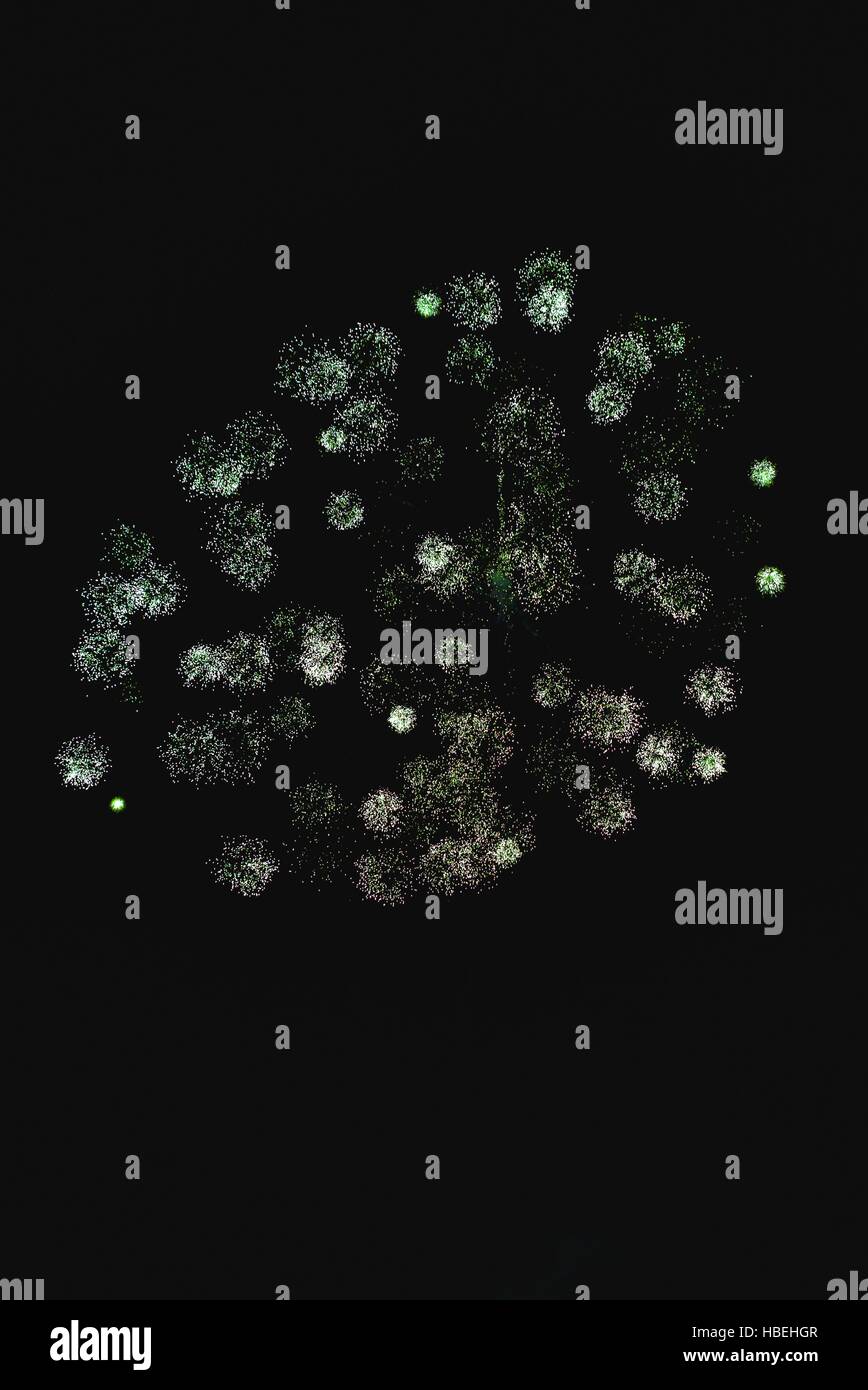 Shiny natural fireworks on dark black sky background with a little ...